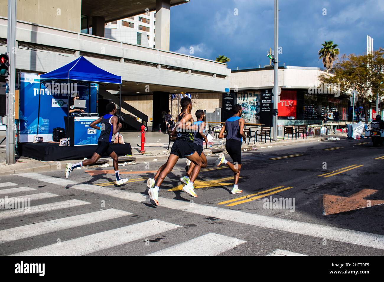 Tel Aviv, Israel - February 25, 2022 Runners in the street of Tel Aviv ...