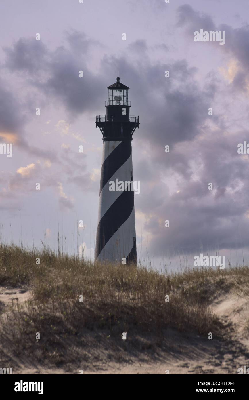 Cape Hatteras Lighthouse against a cloudy sky watching over the Outer ...