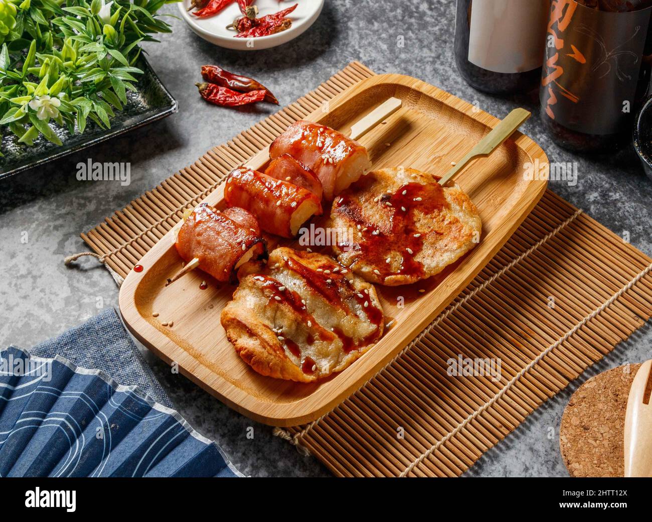 Sweet and not spicy bacon pig sticks in wooden dish isolated mate and ...