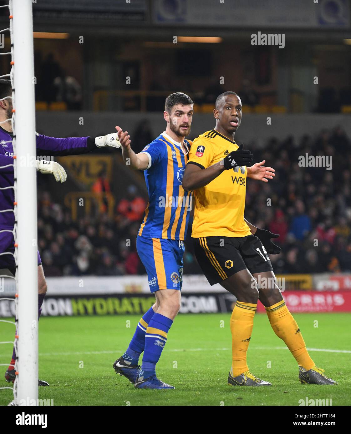 Willy Boly of Wolves and Luke Waterfall of Shrewsbury. Wolverhampton ...