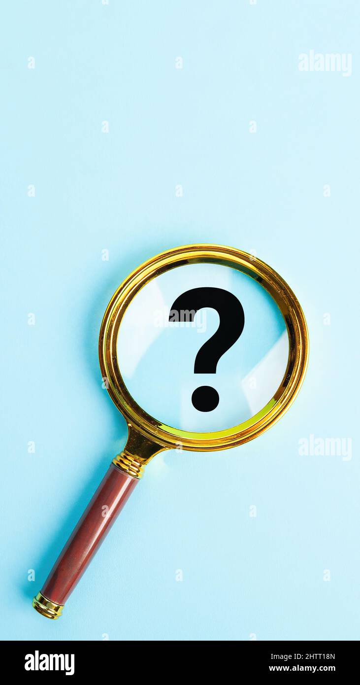 Magnifying glass with question mark symbol on blue background. T Stock ...