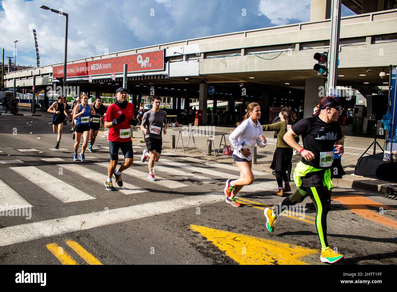 Tel Aviv, Israel - February 25, 2022 Runners in the street of Tel Aviv ...