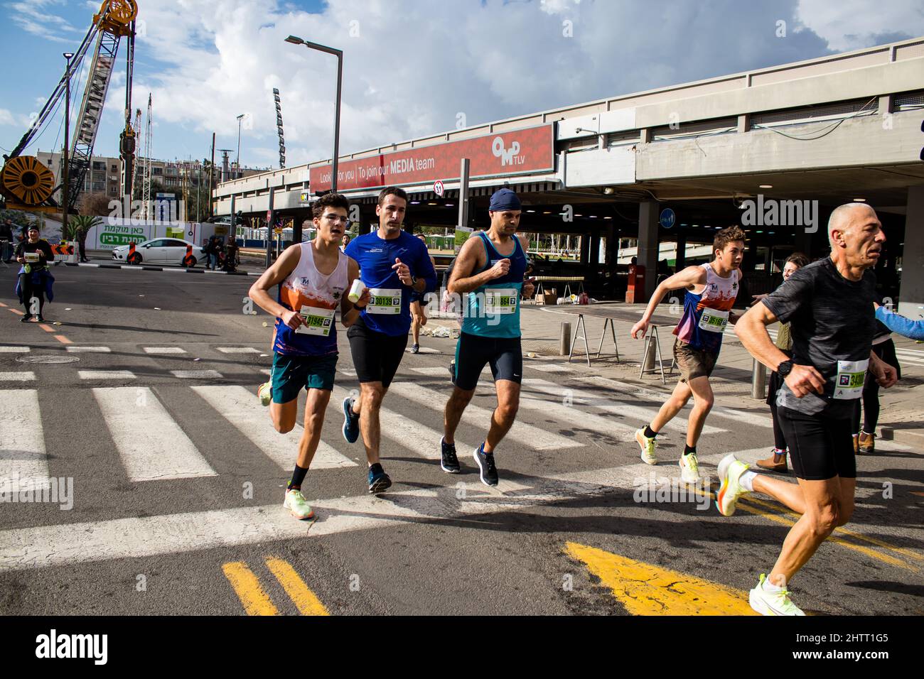 Tel Aviv, Israel - February 25, 2022 Runners in the street of Tel Aviv ...