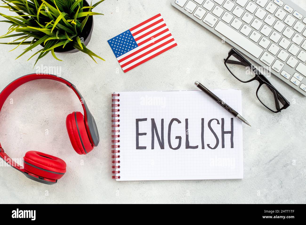 Student table desk - learning English lessons concept Stock Photo - Alamy