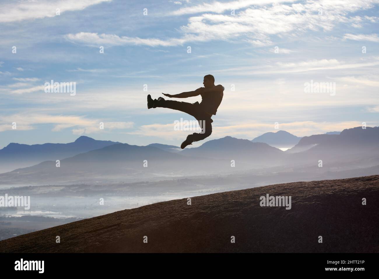 Sports silhouette man practicing kick hi-res stock photography and ...