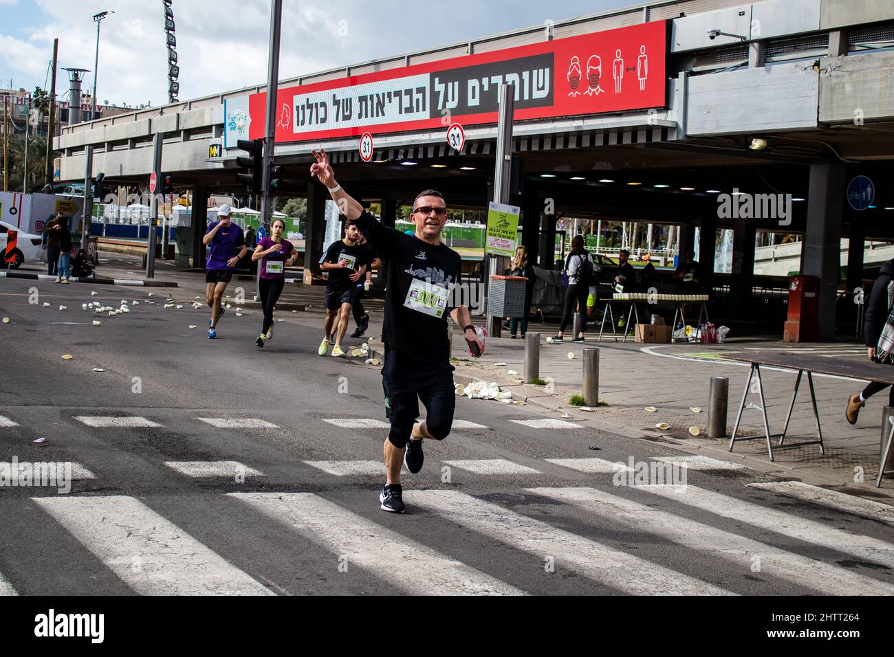Tel Aviv, Israel - February 25, 2022 Runners in the street of Tel Aviv ...