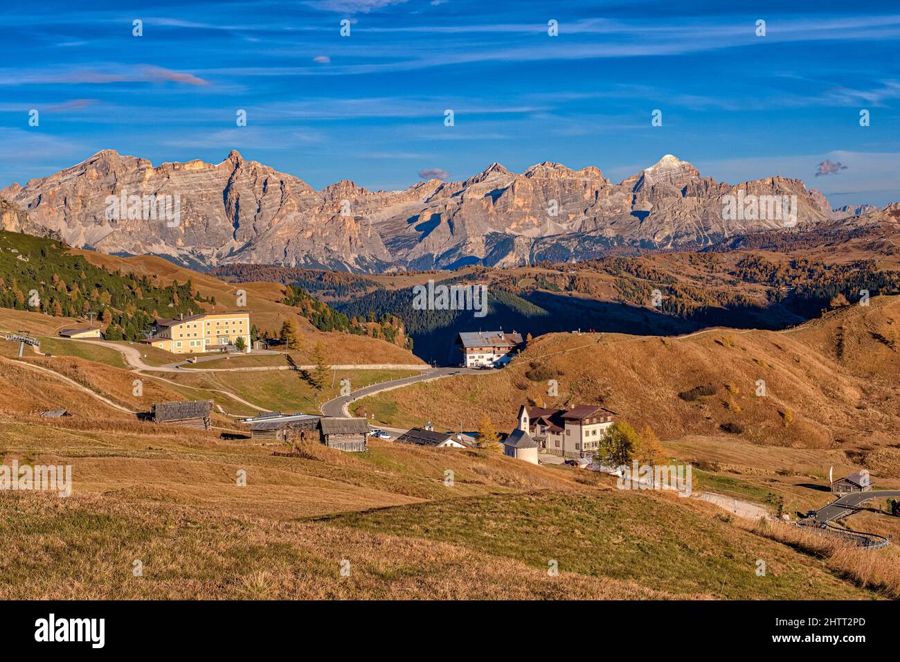 Aerial view on Gardena Pass with buildings on top, summits and rock ...