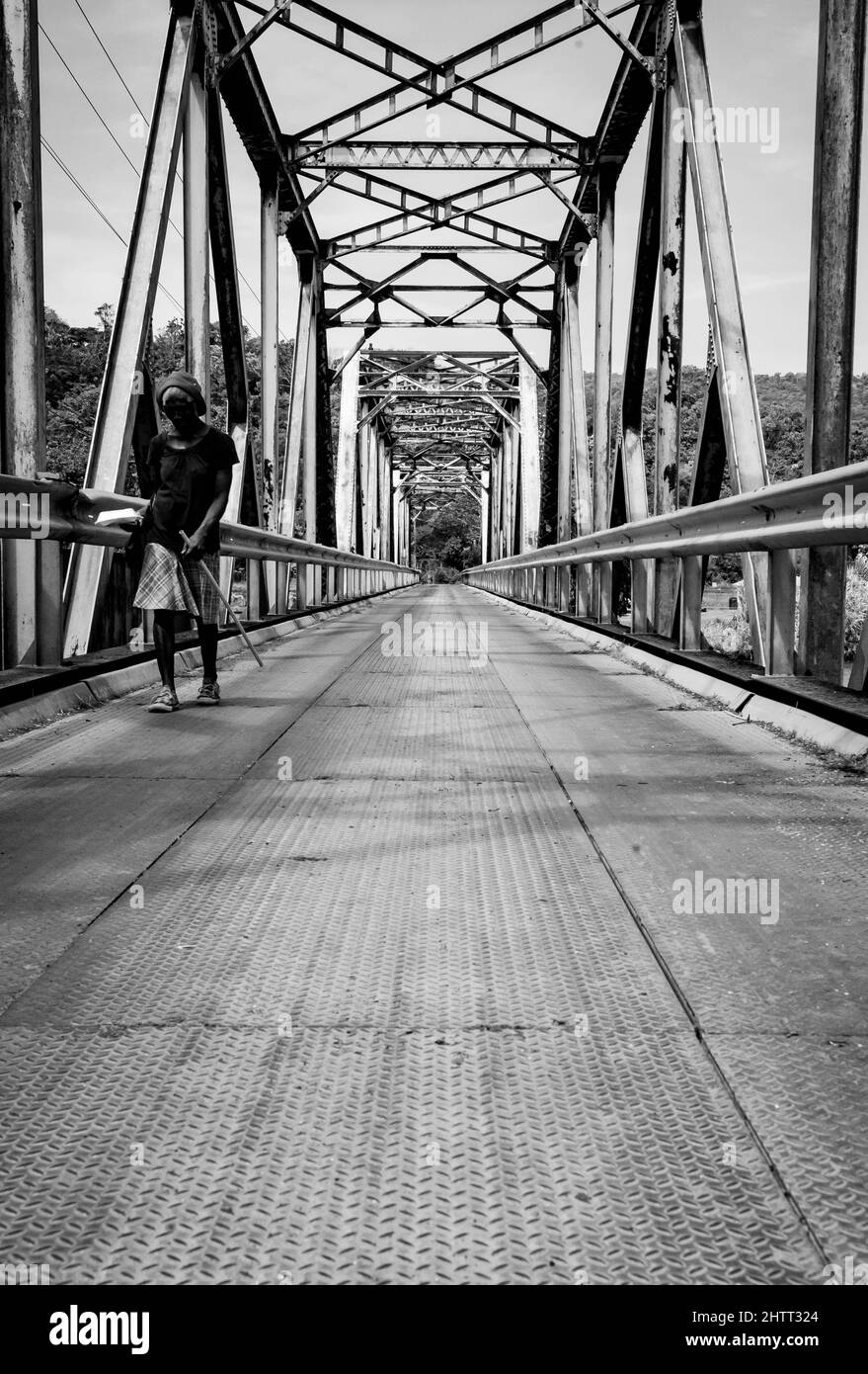 Woman bridge crossing Black and White Stock Photos & Images - Alamy