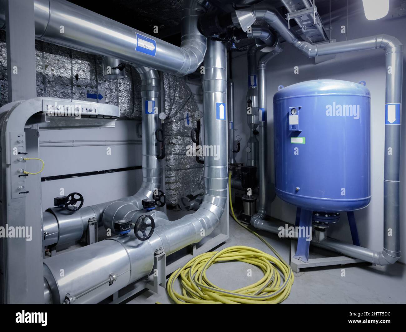 Air conditioning of buildings. Background of ventilation pipes. Laying ...