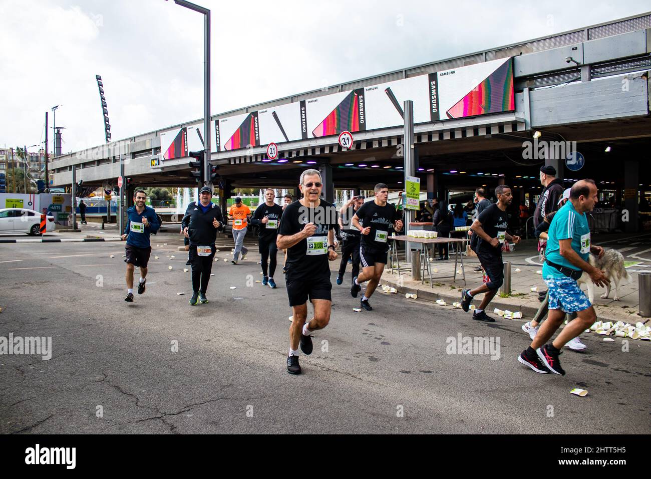 Tel Aviv, Israel - February 25, 2022 Runners in the street of Tel Aviv ...