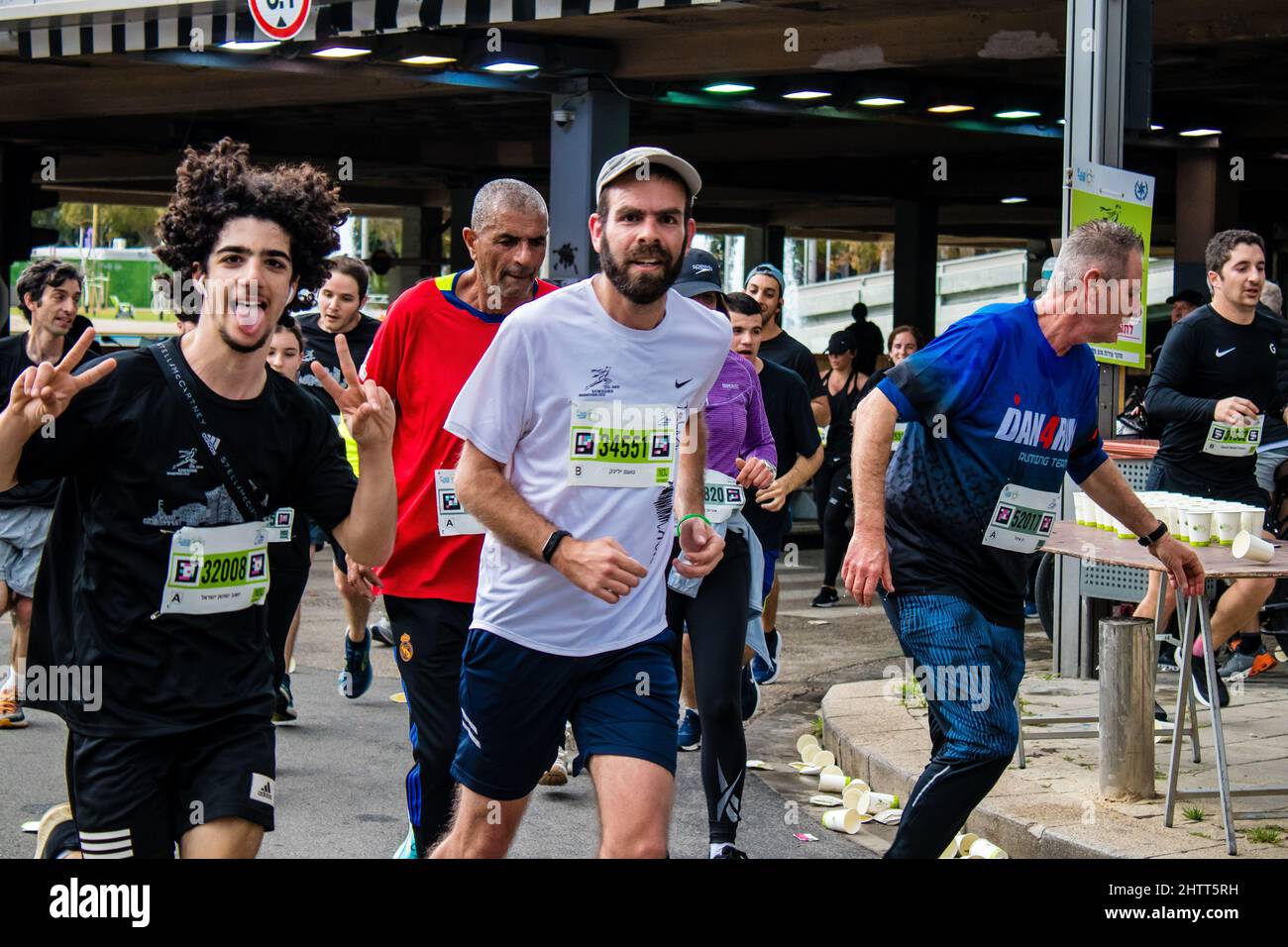 Tel Aviv, Israel - February 25, 2022 Runners in the street of Tel Aviv ...