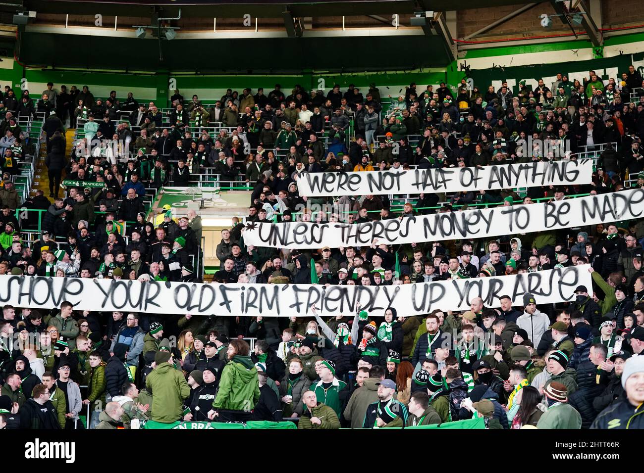Celtic fans hold a banner in protest to an Australian Old Firm friendly ...