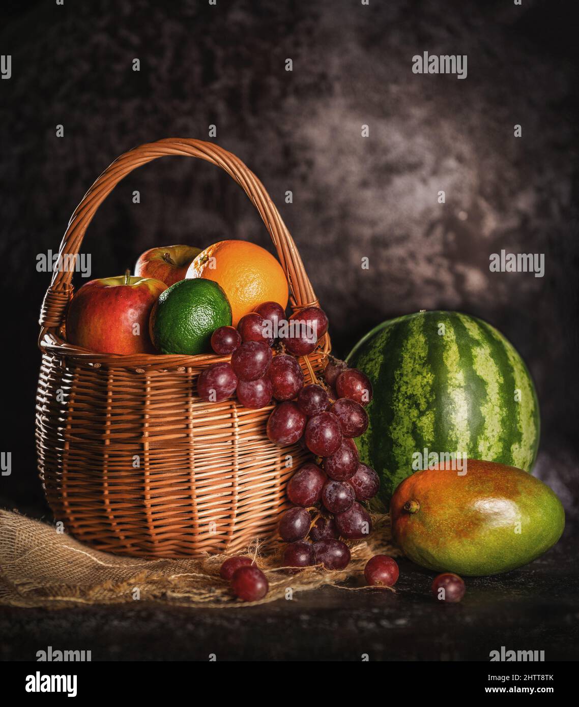 Vertical still life of fruits in a basket Stock Photo - Alamy