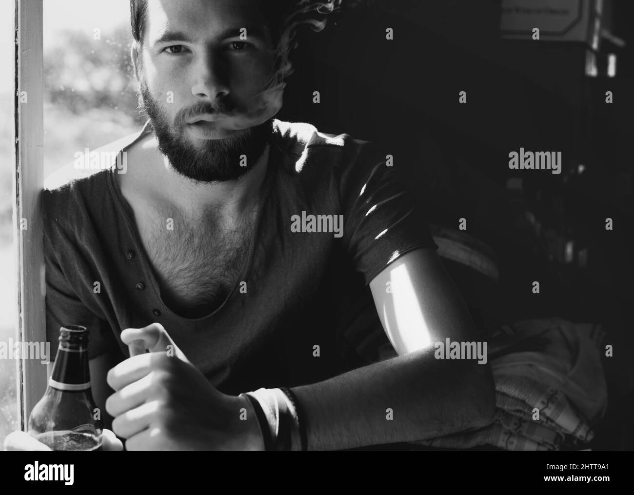 Man smoking exhaling smoke Black and White Stock Photos & Images - Alamy