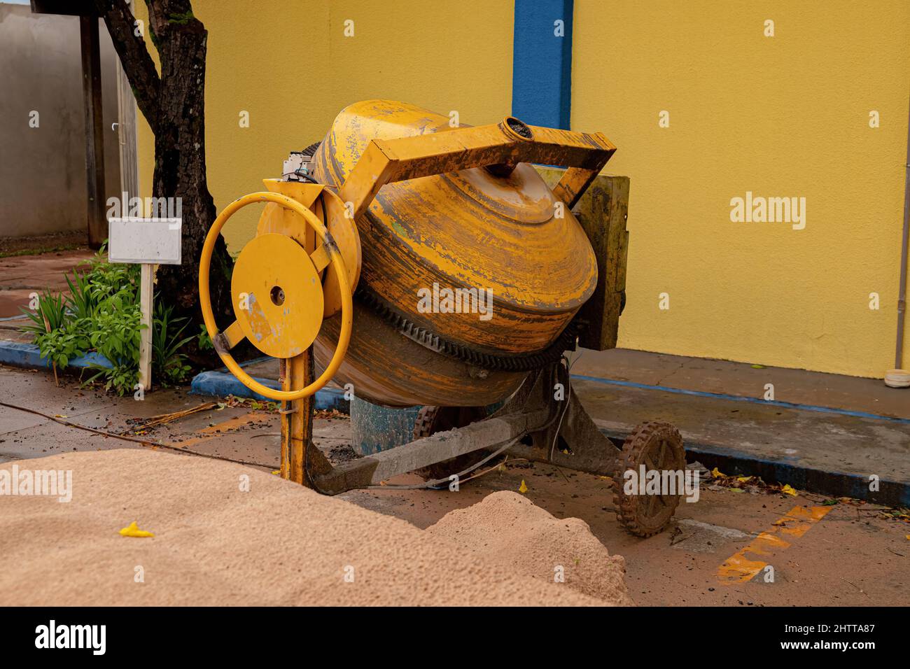 Yellow concrete mixer equipment for production of concrete under ...