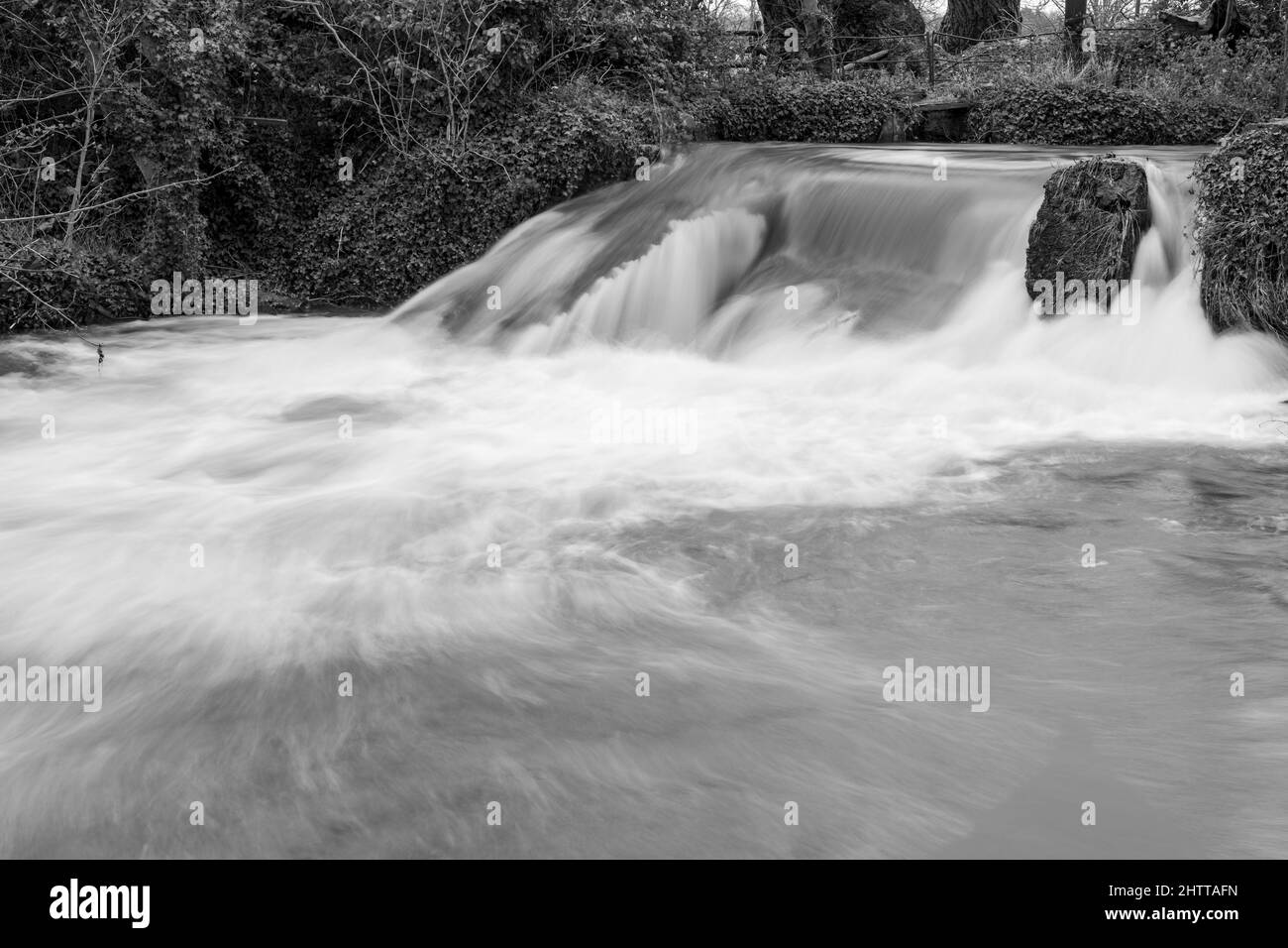 Long exposure of a waterfall on the river Avill in Dunster in Somerset ...