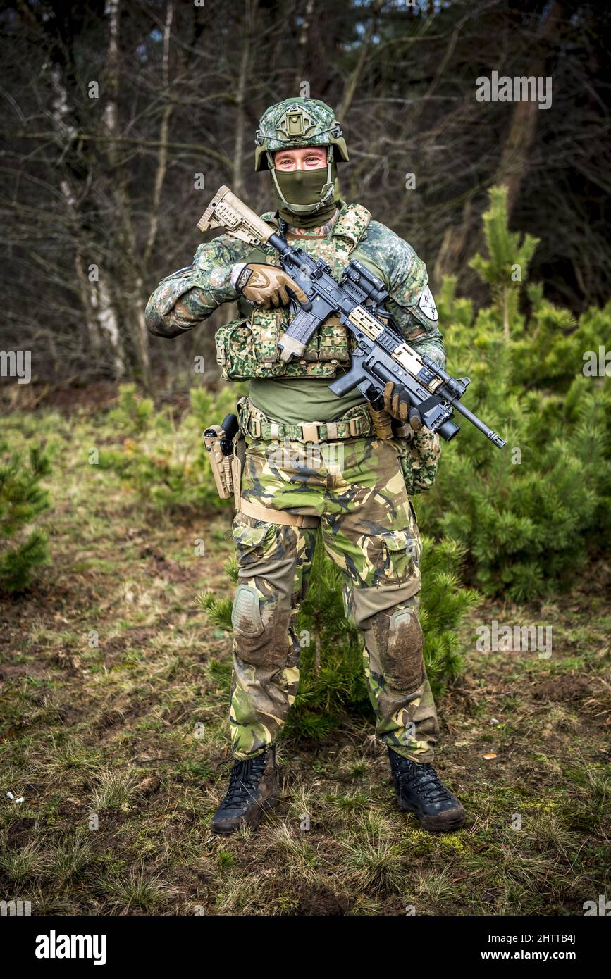 Vertical shot of a dutch soldier in a new uniform and personal ...