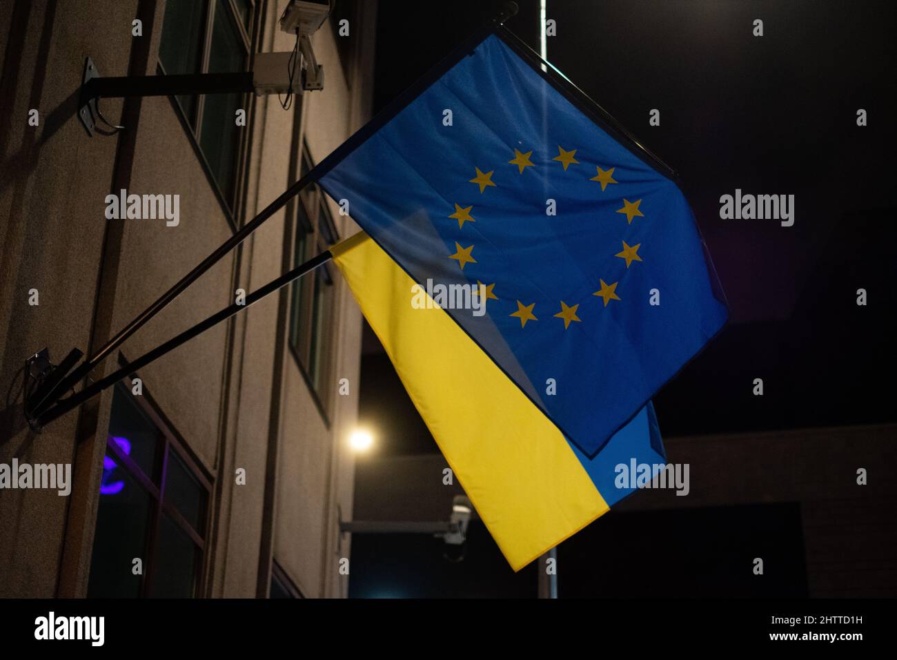 Flags of Ukraine and European Union waving together symbolising ...