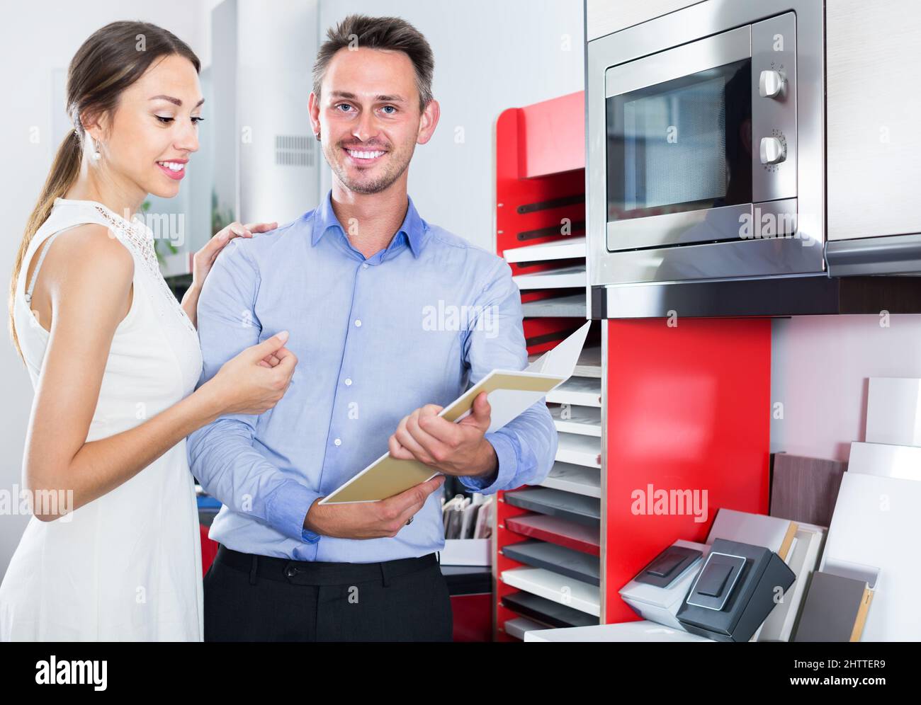 Ordinary smiling family purchasing hi-res stock photography and images ...