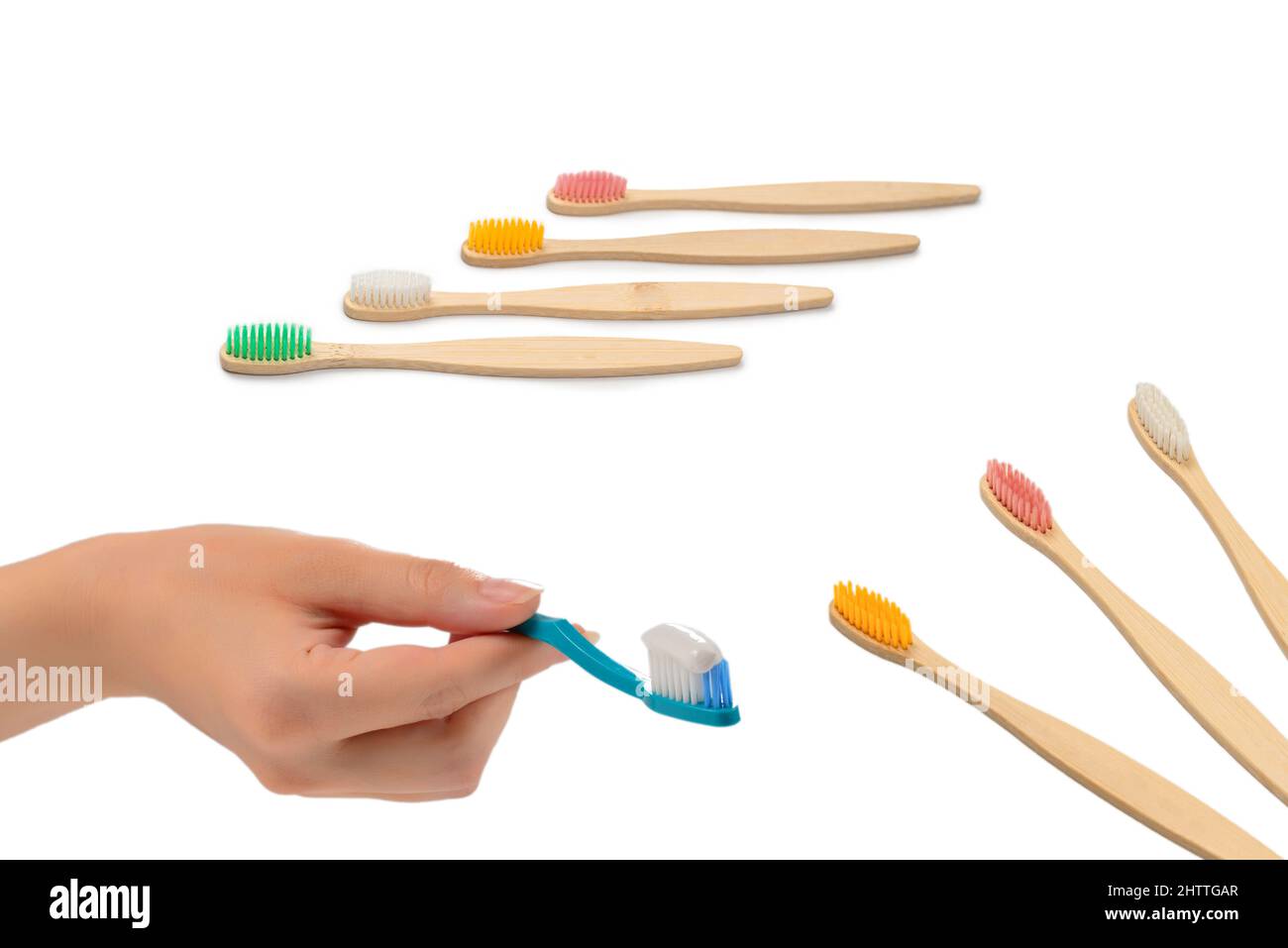 Woman holds toothbrush with toothpaste in her hand isolated on white ...
