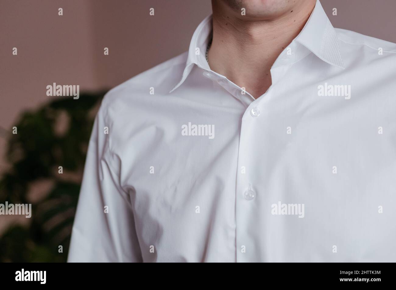 A man fastens a cufflink on his shirt Stock Photo - Alamy