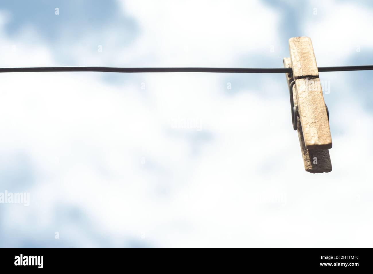 Clothesline fastener on a clothesline with no clothes and blue sky in ...