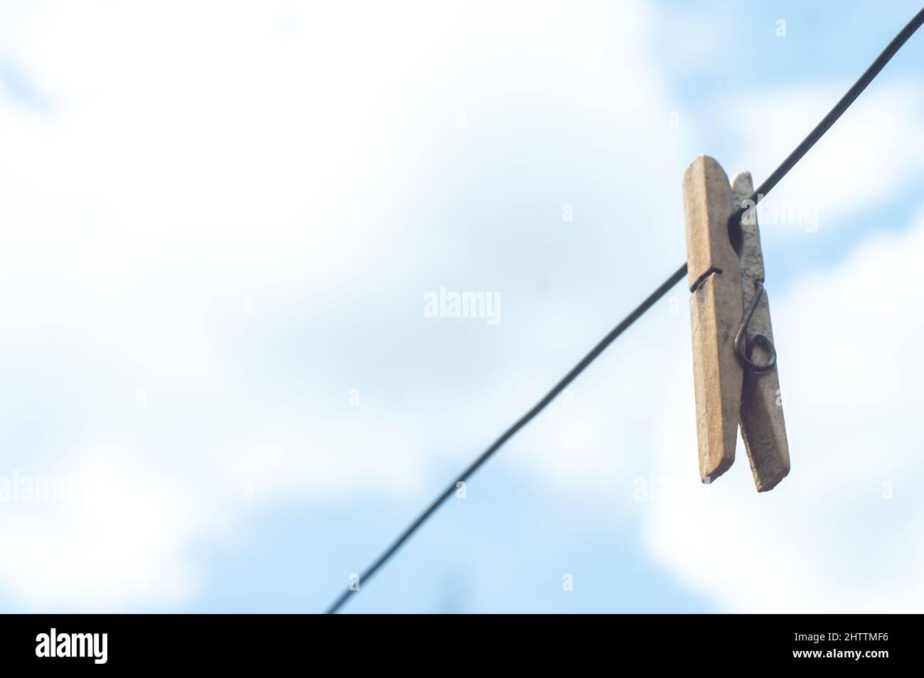 Clothesline fastener on a clothesline with no clothes and blue sky in ...