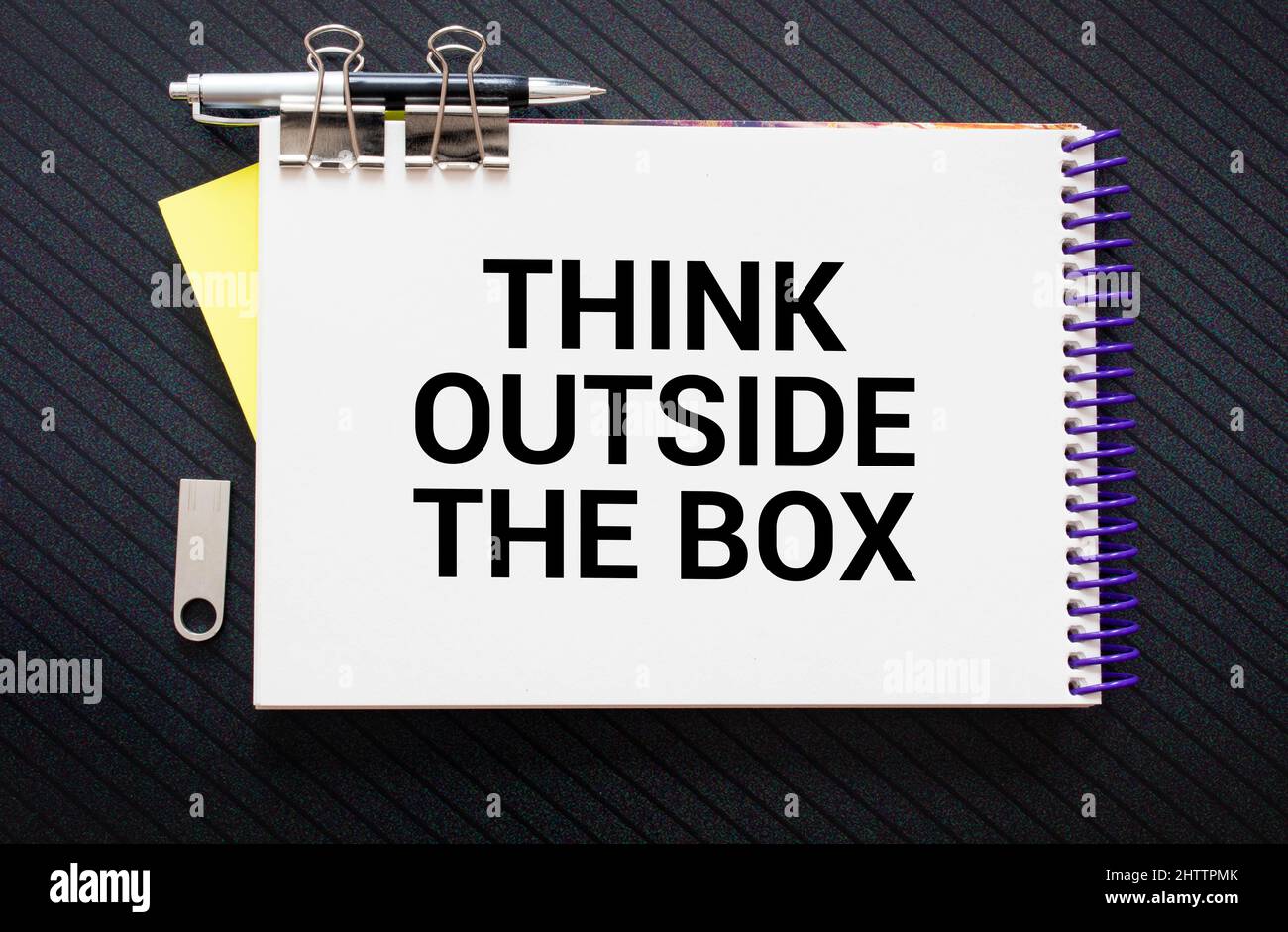Think outside the box slogan Stock Photo - Alamy