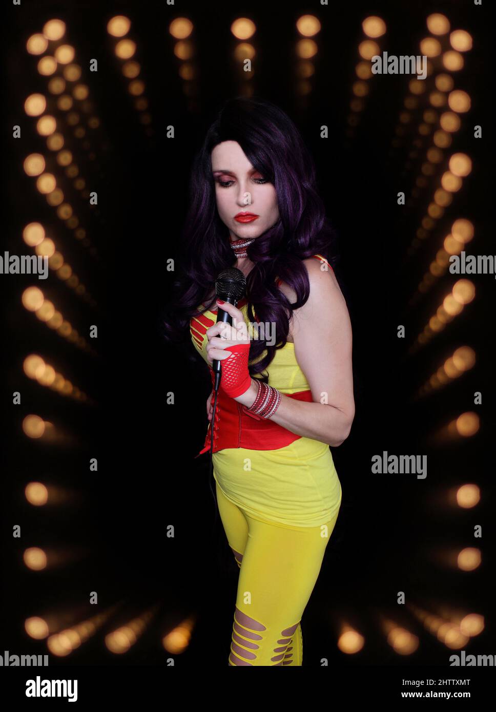 Female singer yellow light hi-res stock photography and images - Alamy