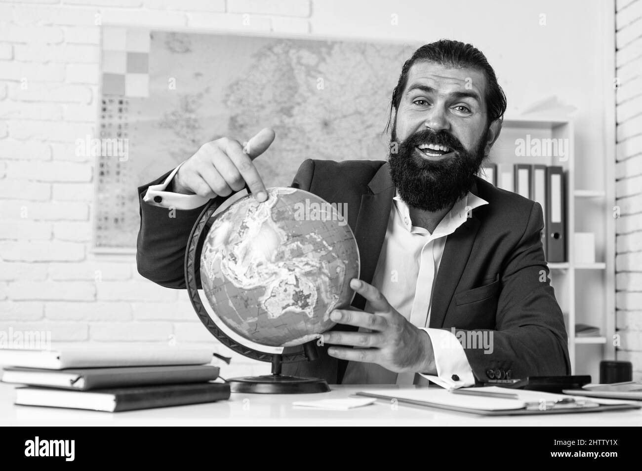 geography studying. informal education. male student sit in school ...