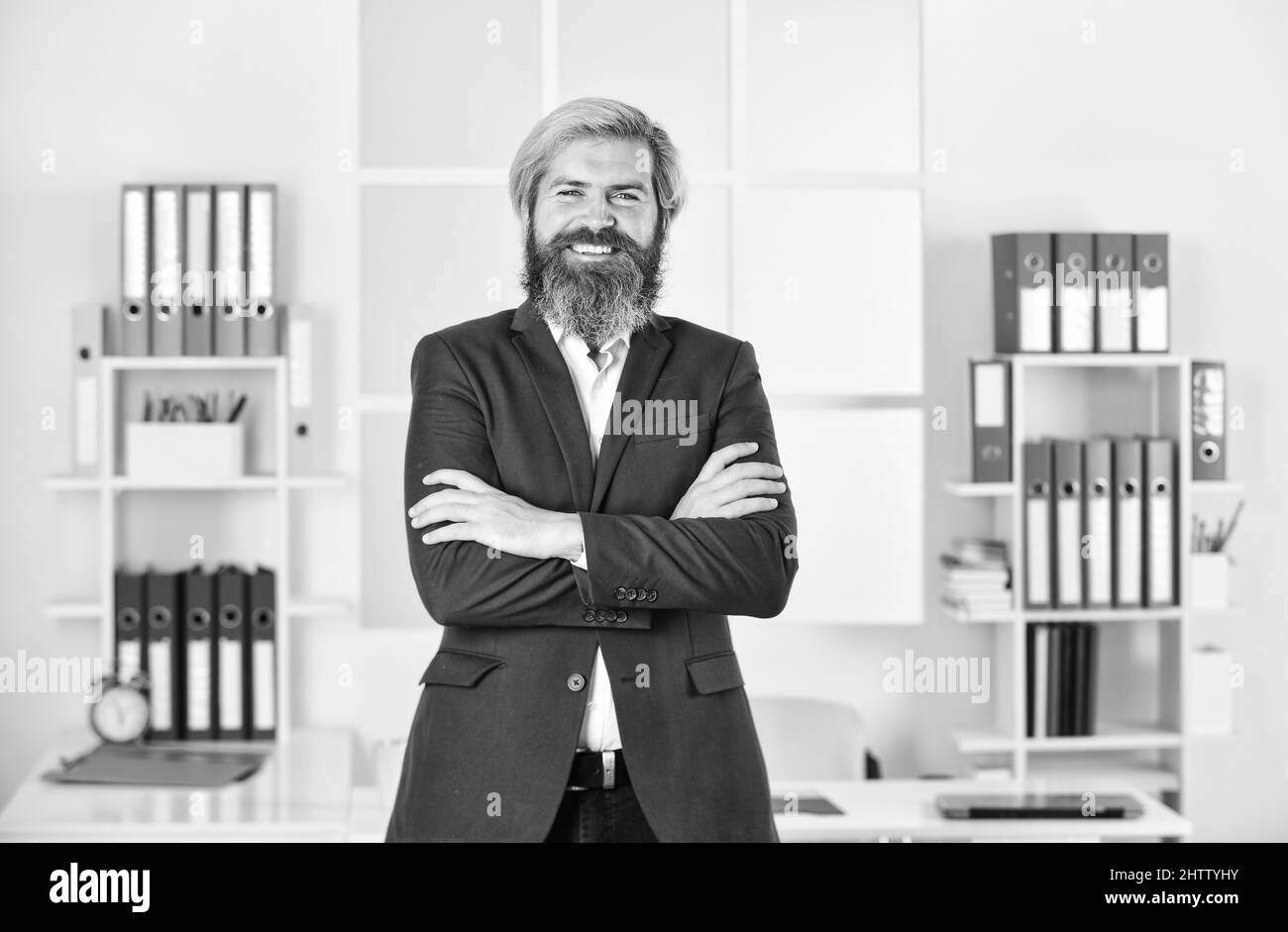 patience and fortitude. Portrait of businessman standing in office ...