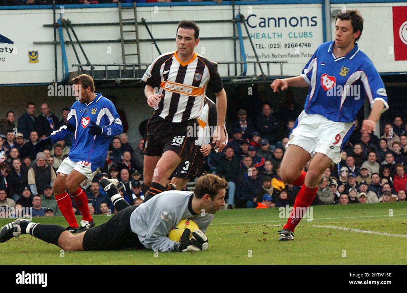 PORTSMOUTH V GRIMSBY. DANNY COYNE GOES DOWN AT THE FEET OF SVETOSLAV ...