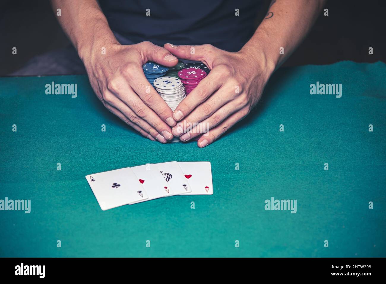Closeup of a man winning at poker Stock Photo - Alamy