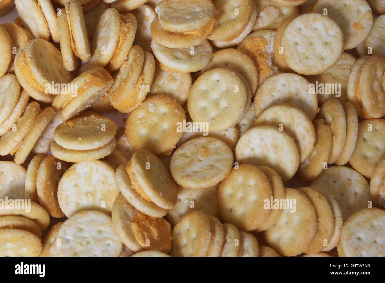 Pile of Mini Cheese Snack Crackers Close up Stock Photo - Alamy
