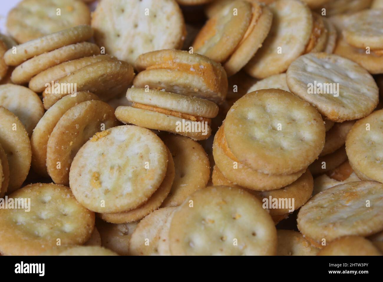 Pile of Mini Cheese Snack Crackers Close up Stock Photo - Alamy