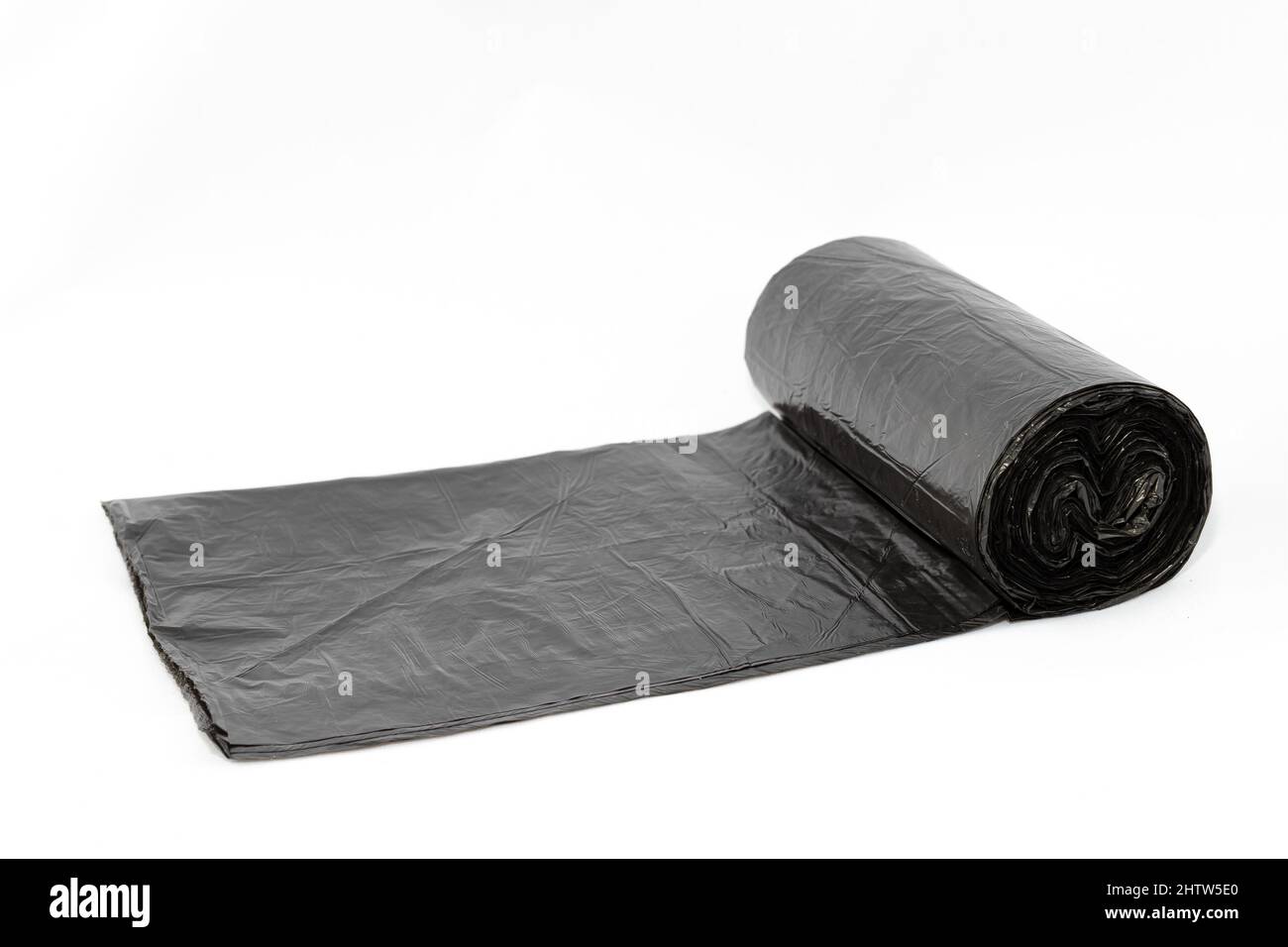 Black Polyethylene Garbage Bags on White Background - Close-Up. The ...