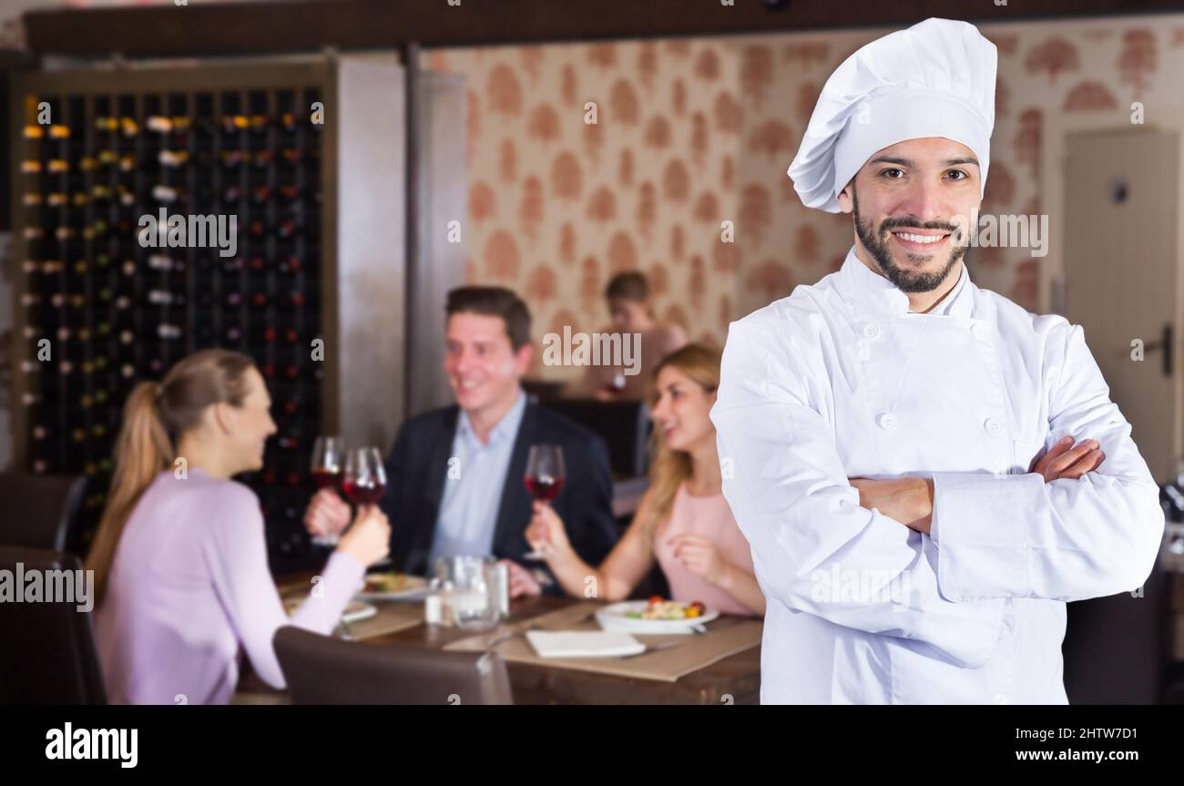 Confident smiling chef standing in restaurant hall Stock Photo - Alamy