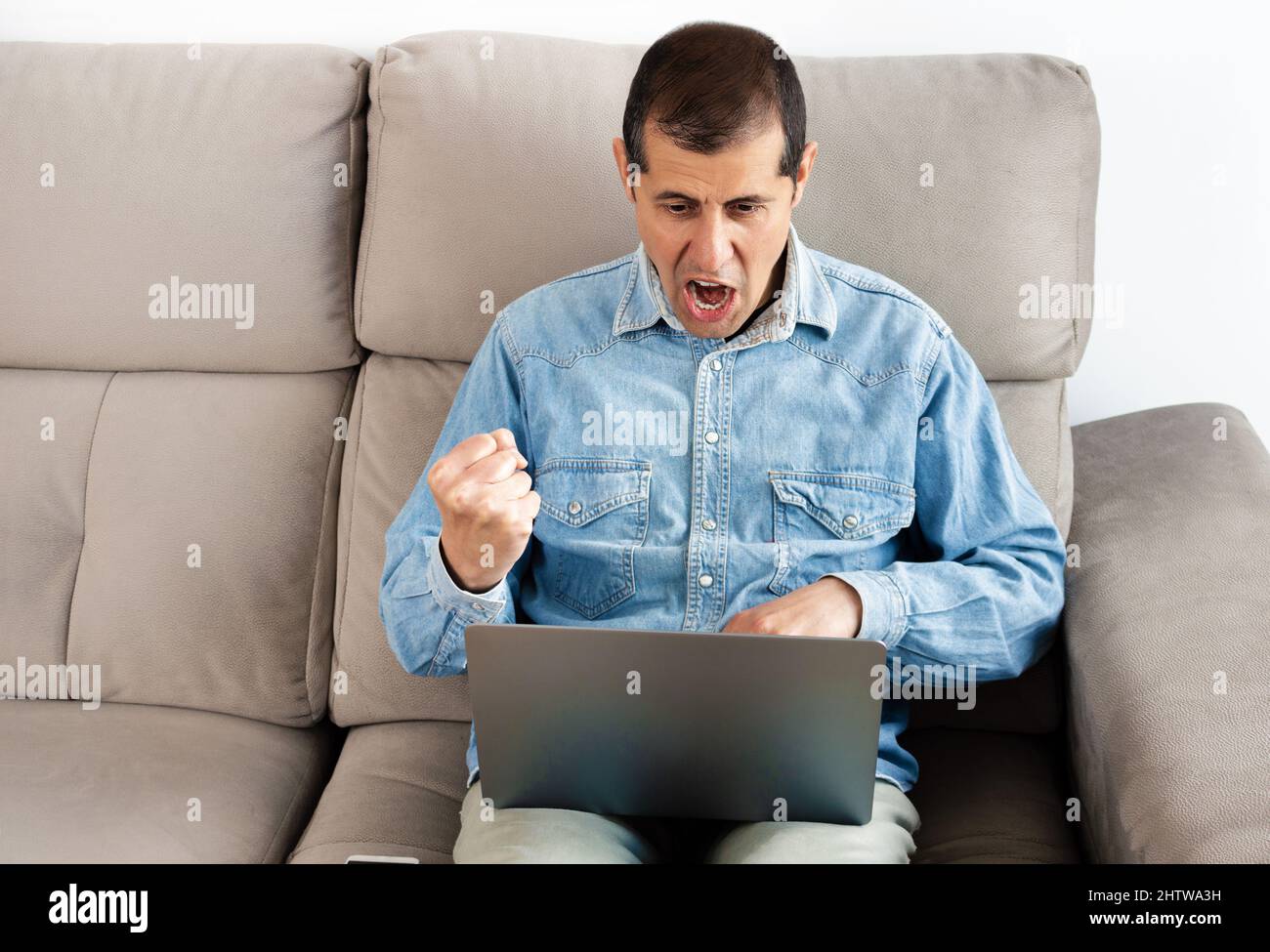Angry furious businessman working on hi-res stock photography and ...