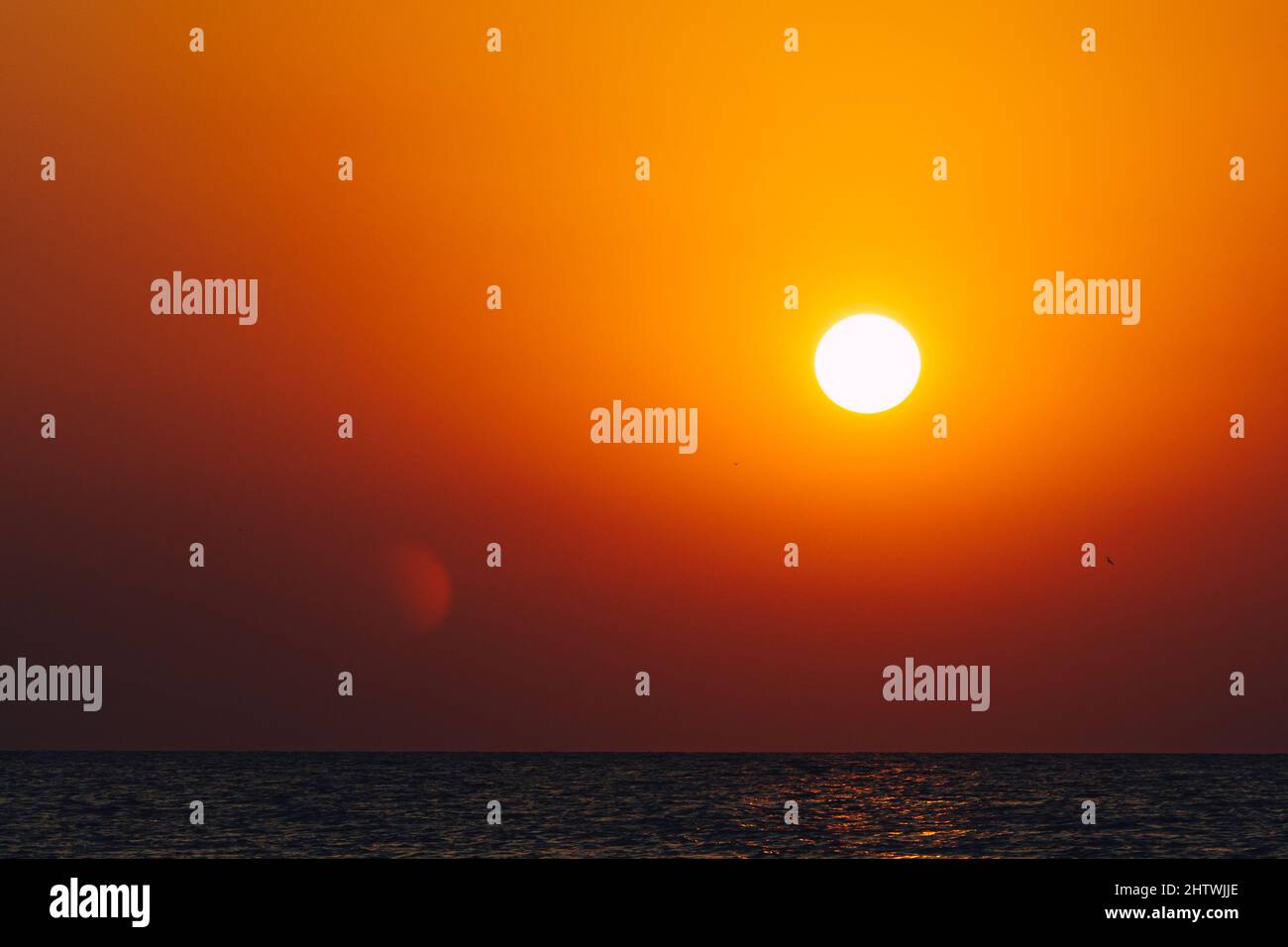Sun flare over water hi-res stock photography and images - Alamy
