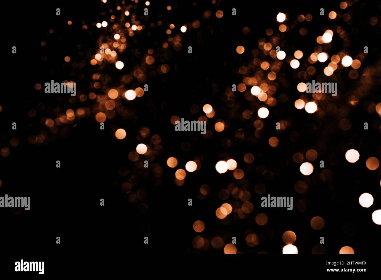 Shiny lights against black background Stock Photo - Alamy