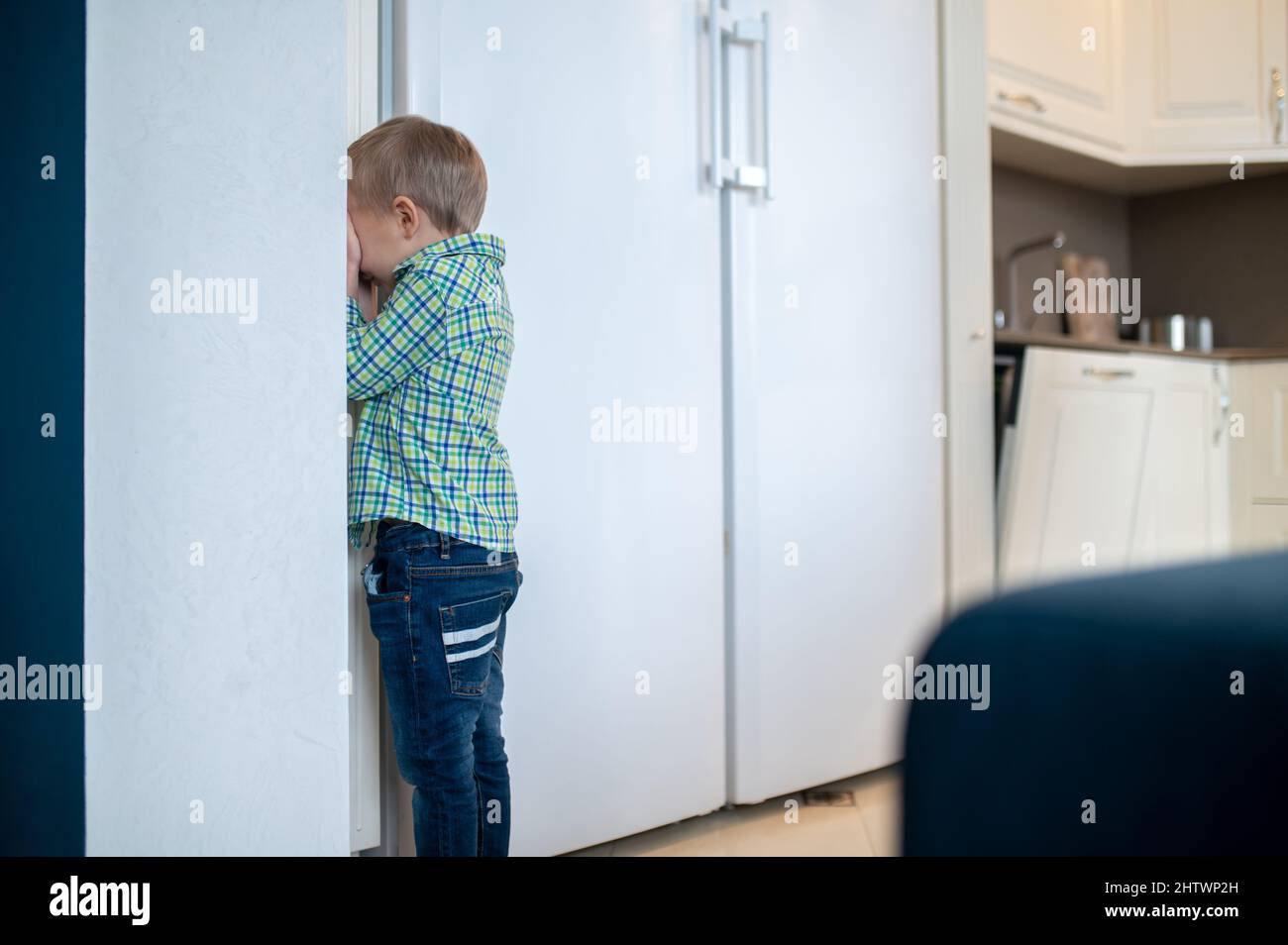Child playing hide and seek inside hi-res stock photography and images ...