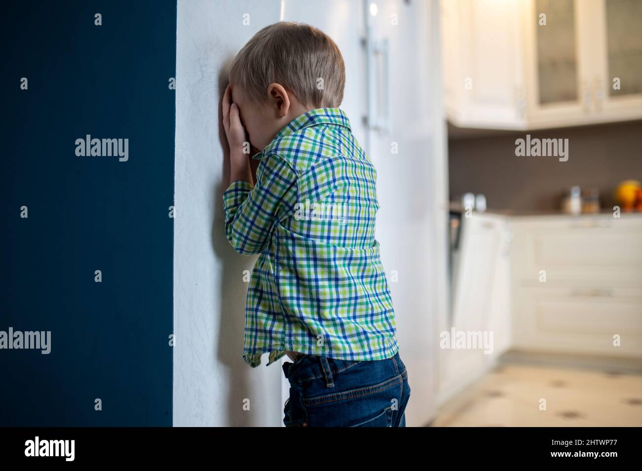 Child playing hide and seek inside hi-res stock photography and images ...