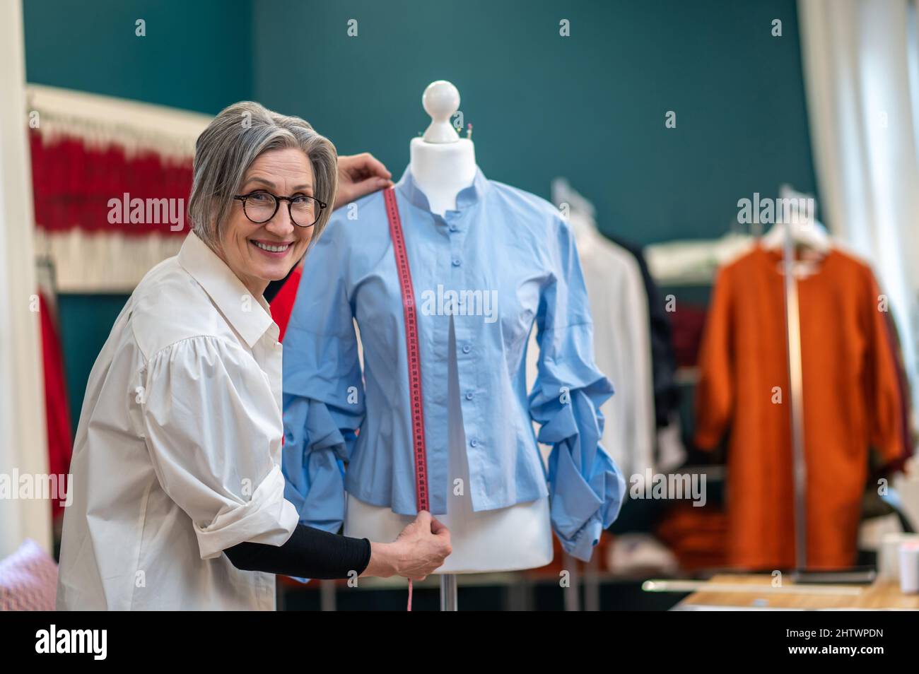 Woman looking camera measuring hi-res stock photography and images - Alamy