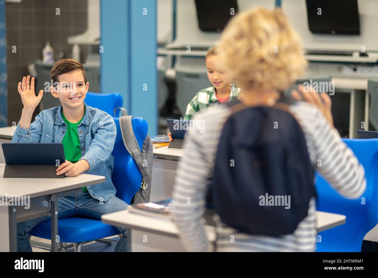 Boy girl standing greeting hi-res stock photography and images - Alamy