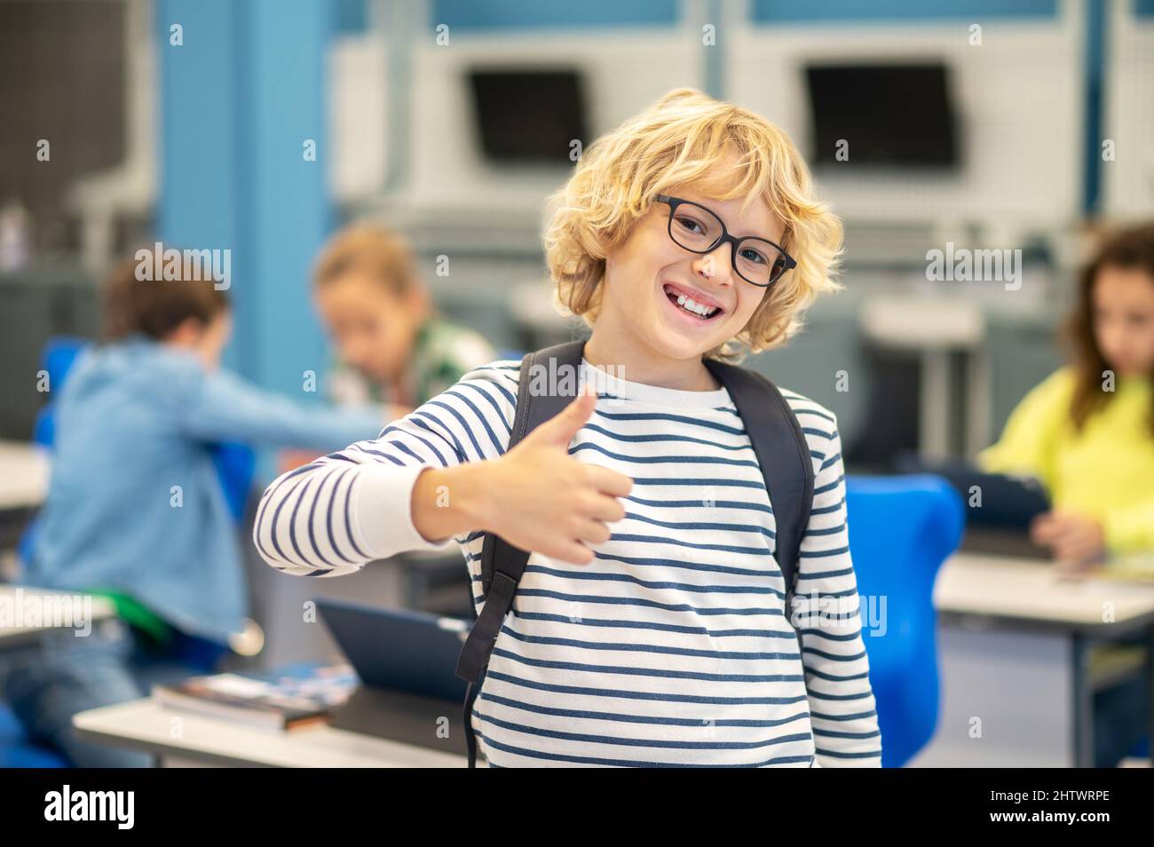 Boy showing finger ok sign at camera Stock Photo - Alamy