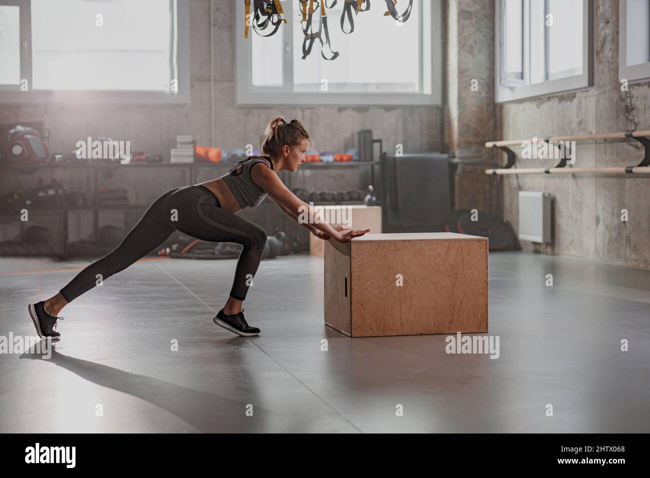 Fitness lady training with feet box at gym Stock Photo - Alamy