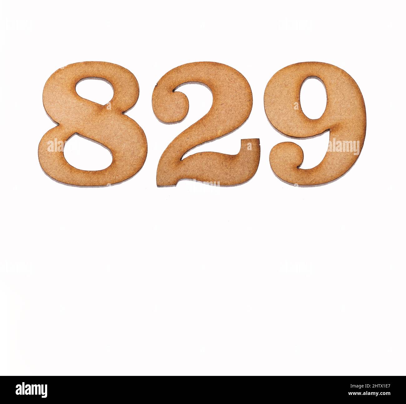 Number 829 in wood, isolated on white background Stock Photo - Alamy