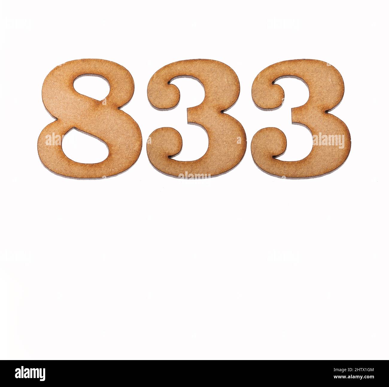 Number 833 in wood, isolated on white background Stock Photo - Alamy