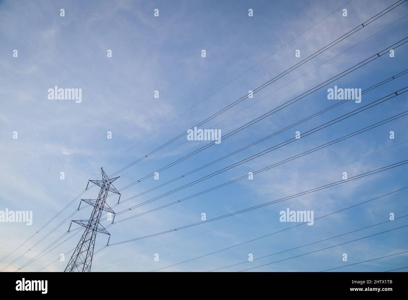 High voltage post tower with blue sky before sunset background Stock ...