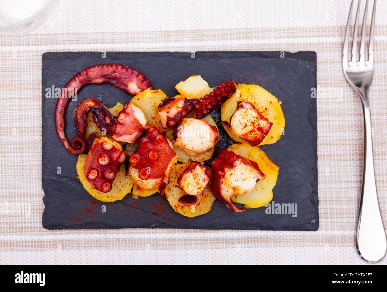 Dish of Spanish cuisine is the octopus in Galician Stock Photo - Alamy